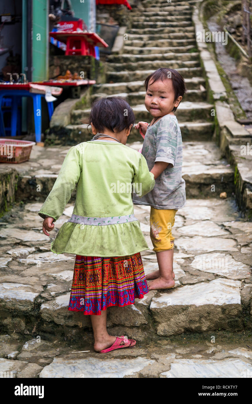 Two poor children walking alone, Cat Cat, a Traditional Black H’Mong ...