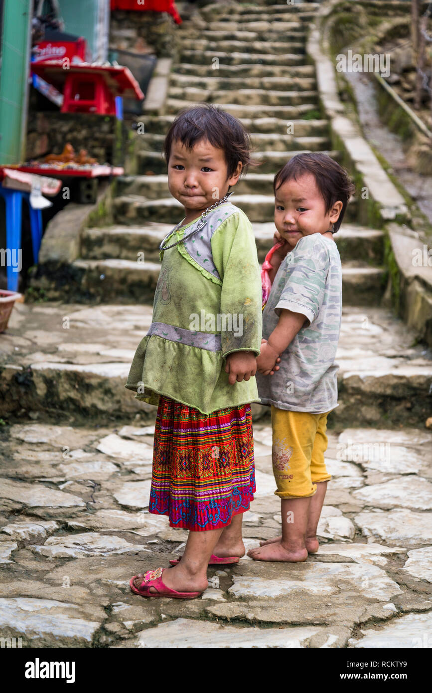 Two poor children walking alone, Cat Cat, a Traditional Black H’Mong ...