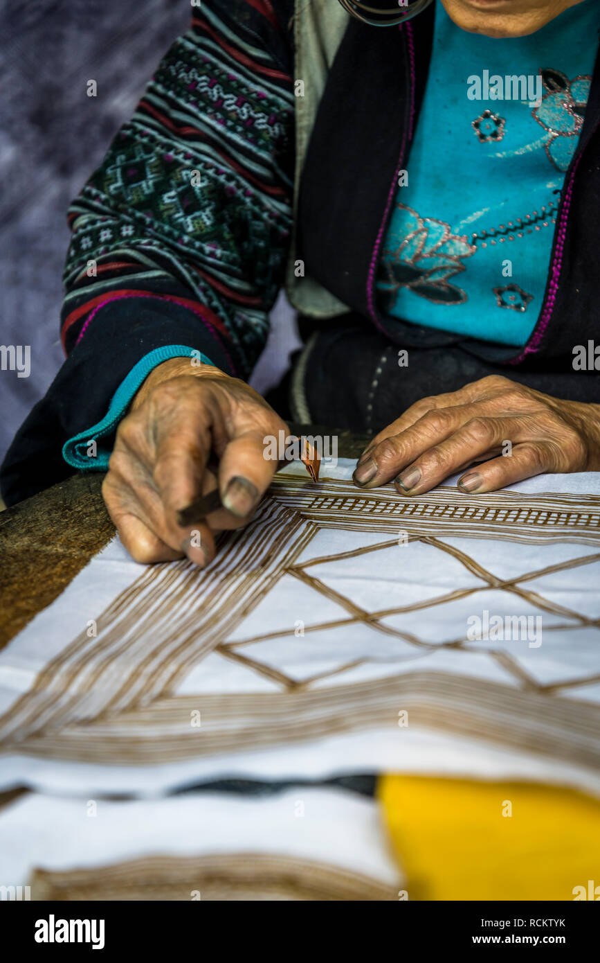 Woman making pattern with wax on fabric, Cat Cat, a Traditional Black H ...