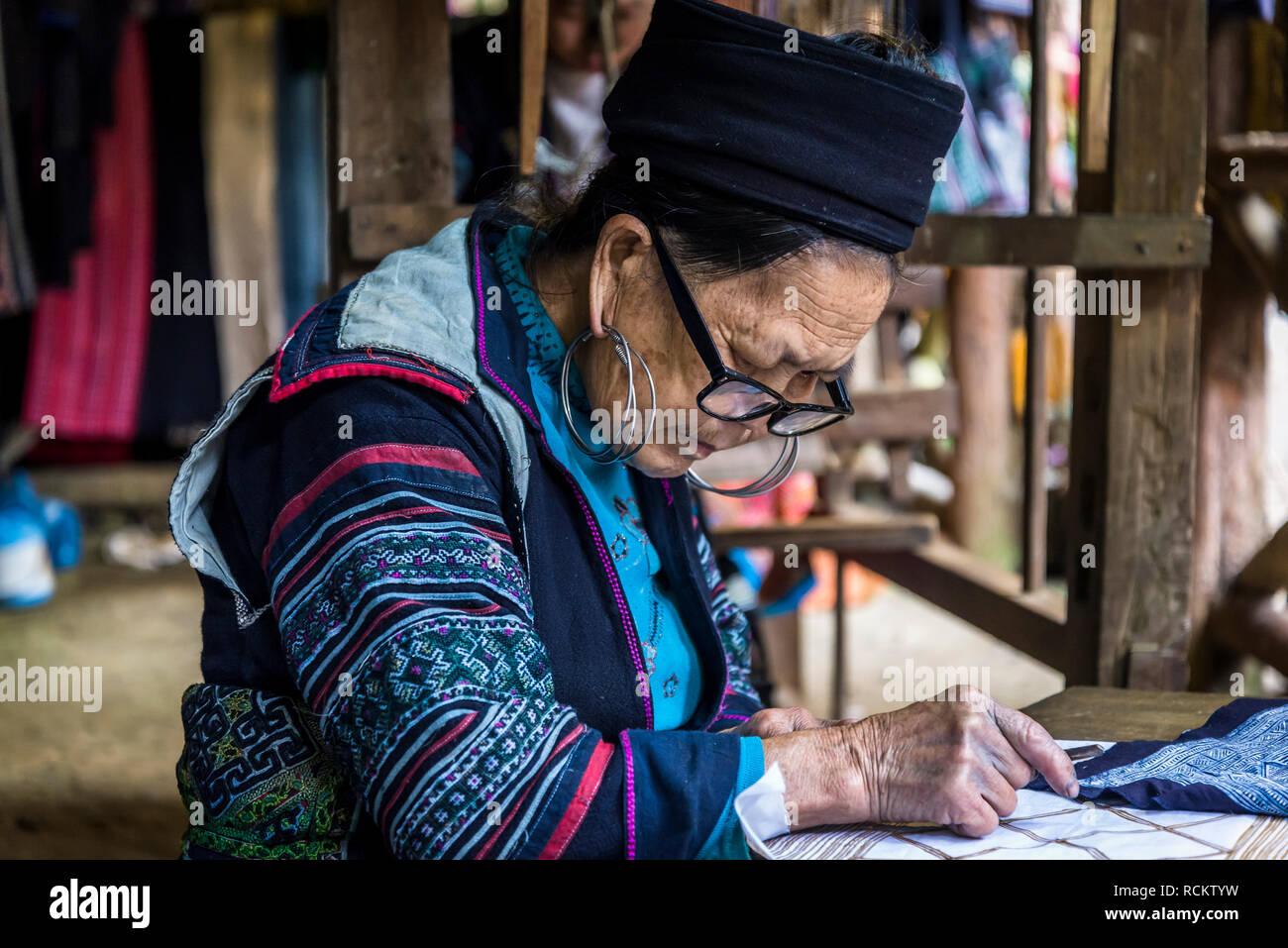 Woman making pattern with wax on fabric, Cat Cat, a Traditional Black H ...