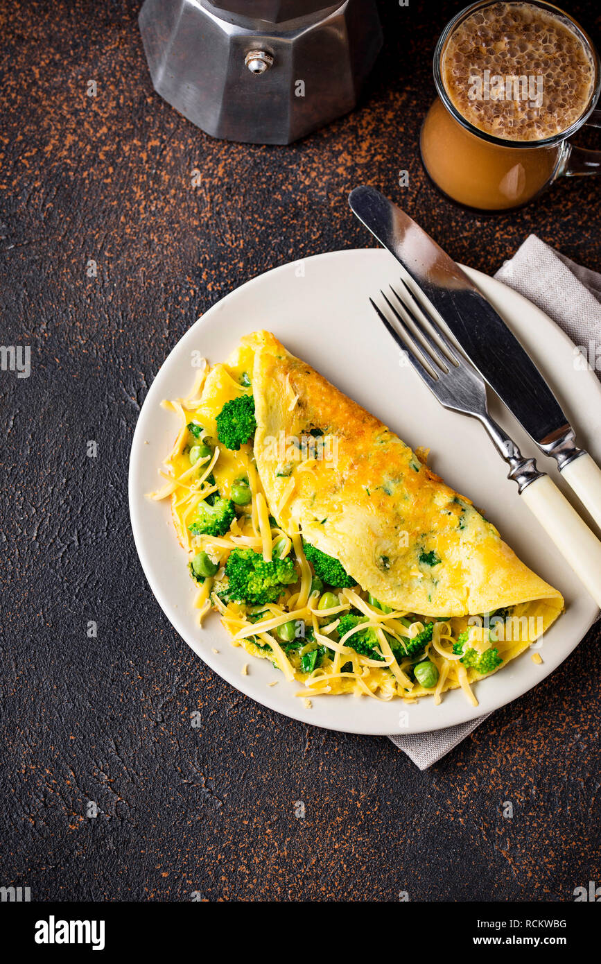 Omelette with green vegetable and cheese Stock Photo - Alamy