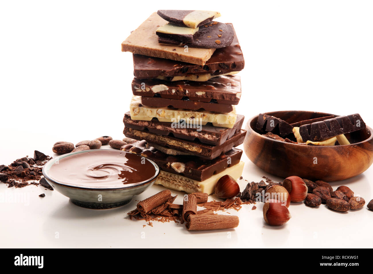 Chocolate bars on table with chocolate tower. Chocolate and nuts and ...