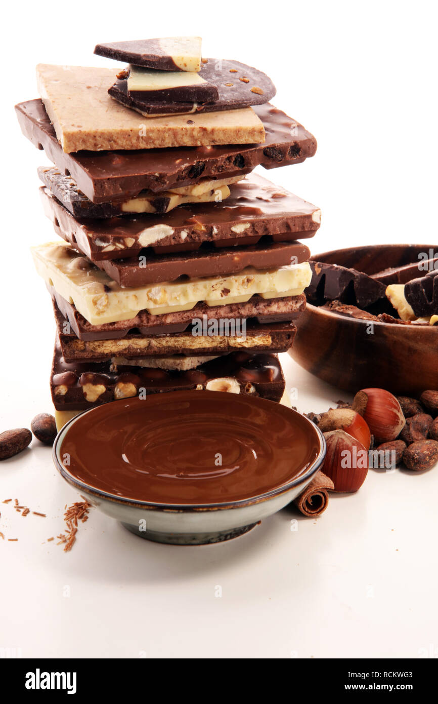 Chocolate bars on table with chocolate tower. Chocolate and nuts and ...