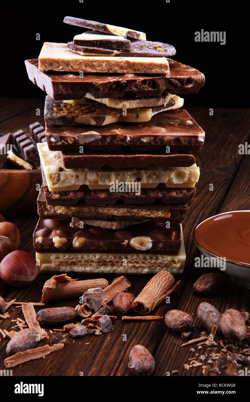 Chocolate bars on table with chocolate tower. Chocolate and nuts and ...