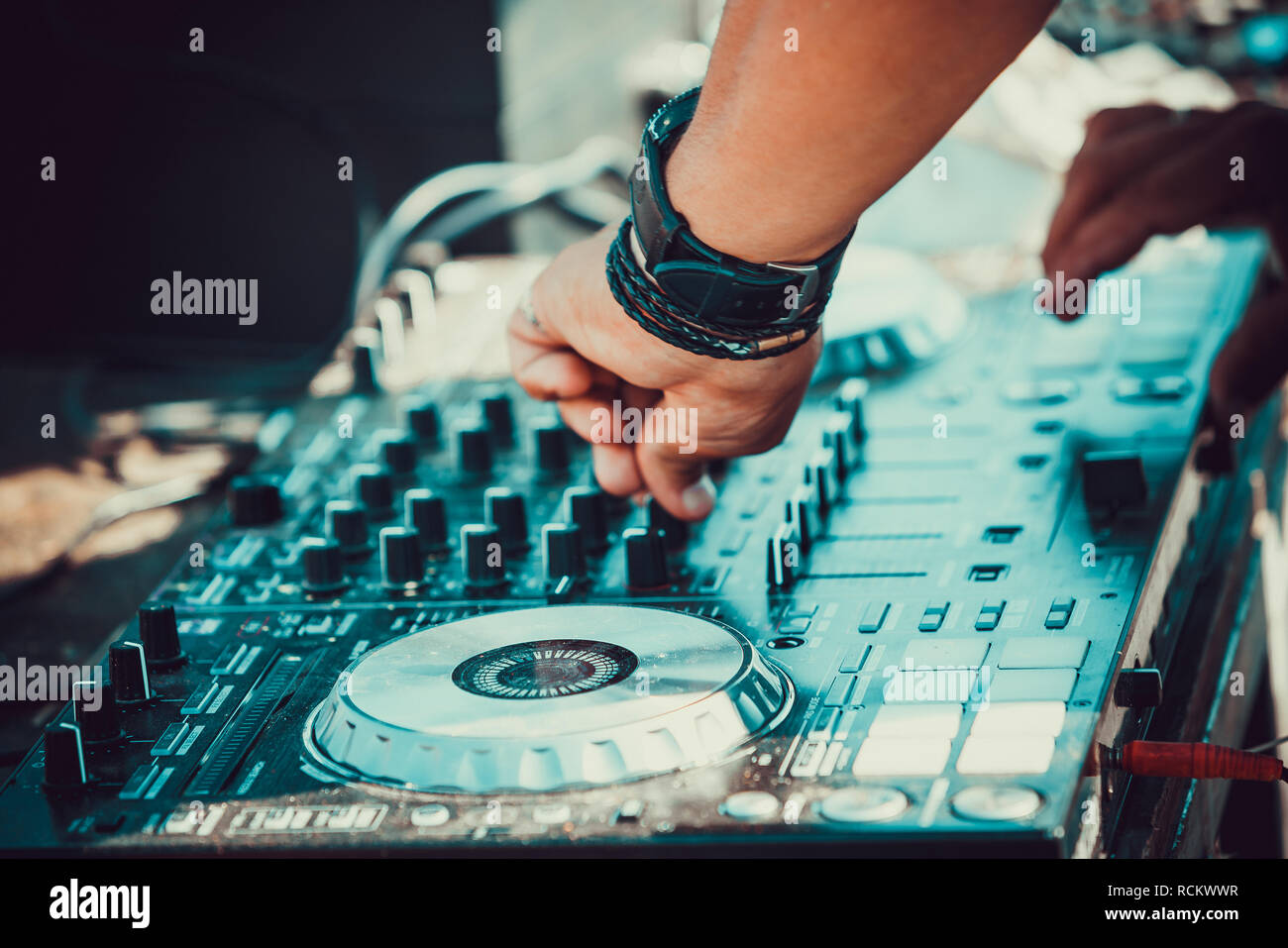 dj controller with hands of dj Stock Photo - Alamy