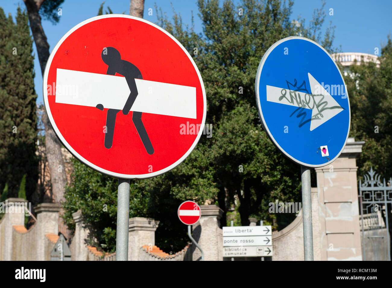 No Entry road sign defaced by street artist, Florence, Italy Stock ...