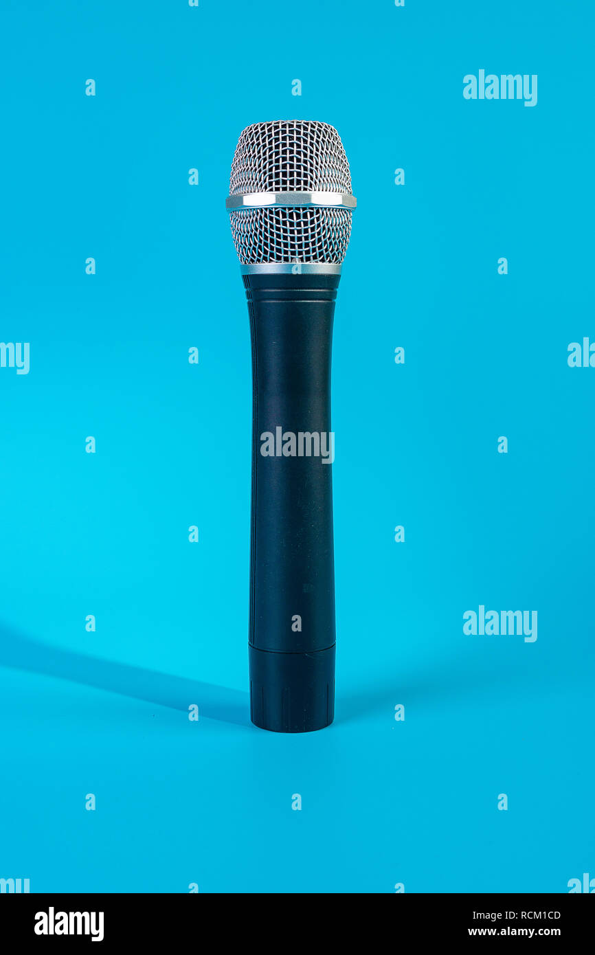 microphone isolated on blue background Stock Photo - Alamy