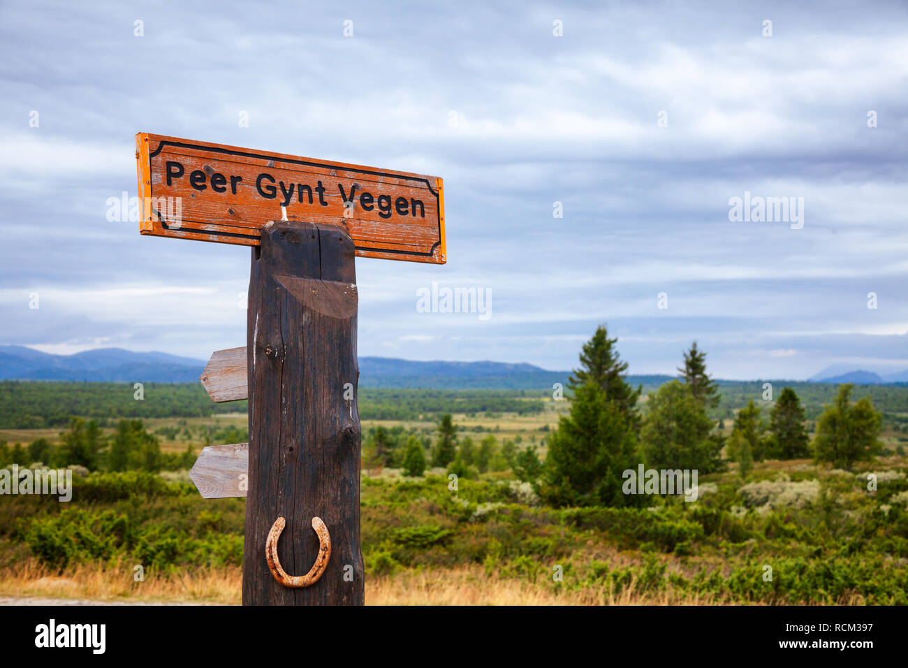 Wooden signpost of Peer Gynt Vegen, a scenic tourist mountain toll road ...