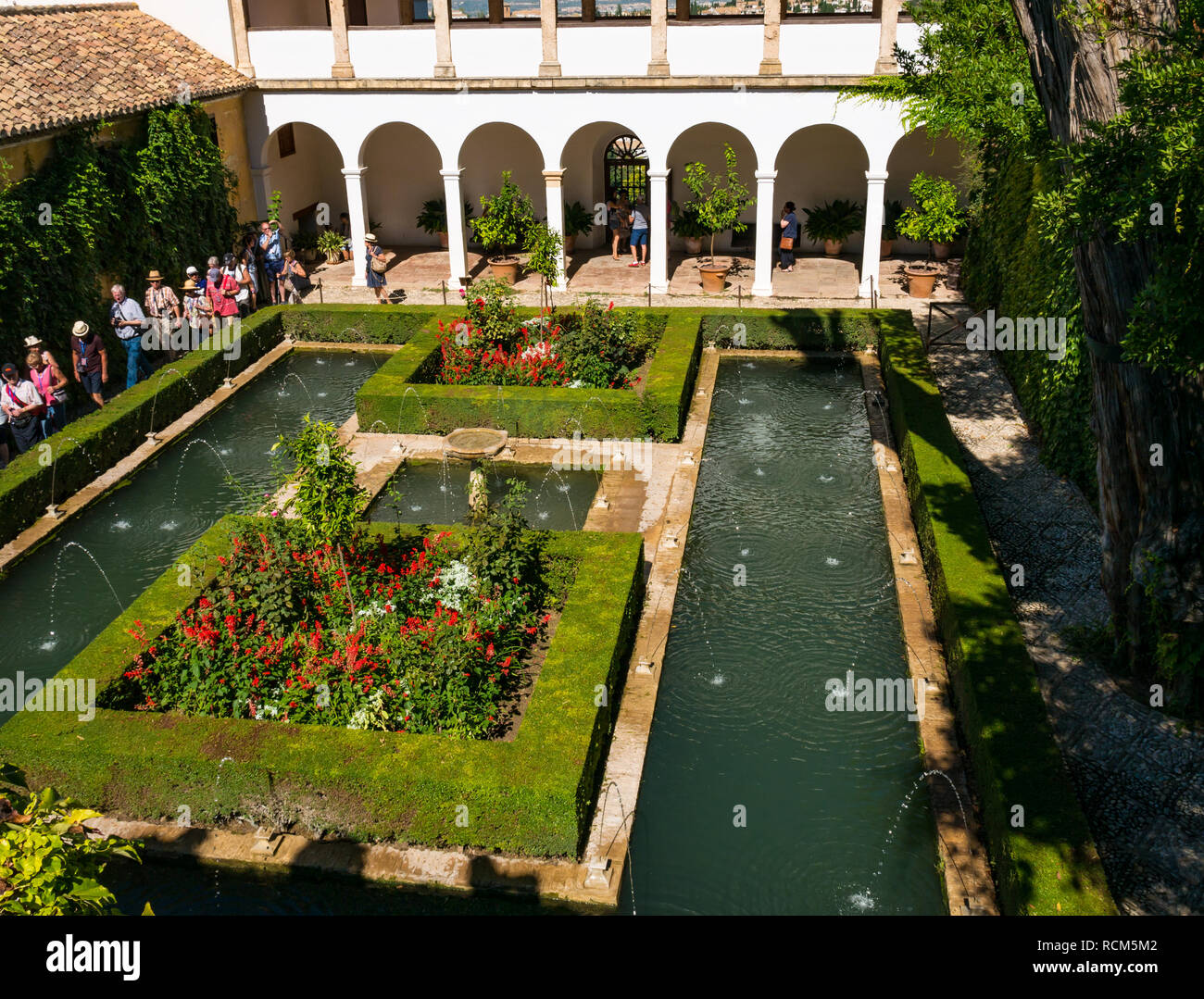 Tourists in Water Channel courtyard with pools and fountains ...
