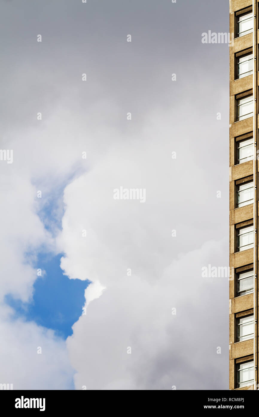 picture of a corner of a high rise with clouded sky Stock Photo - Alamy