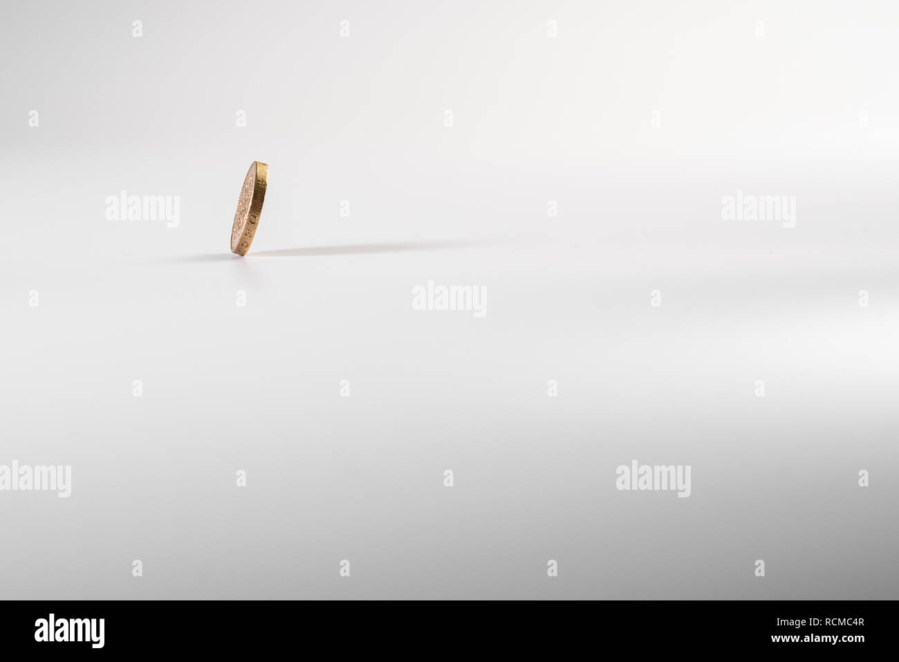 1 British pound coin falling on white background, isolated Stock Photo ...