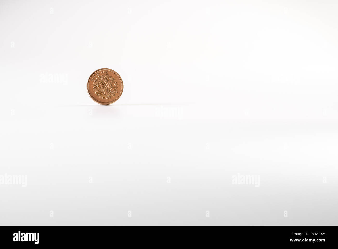 1 British pound coin falling on white background, isolated Stock Photo ...