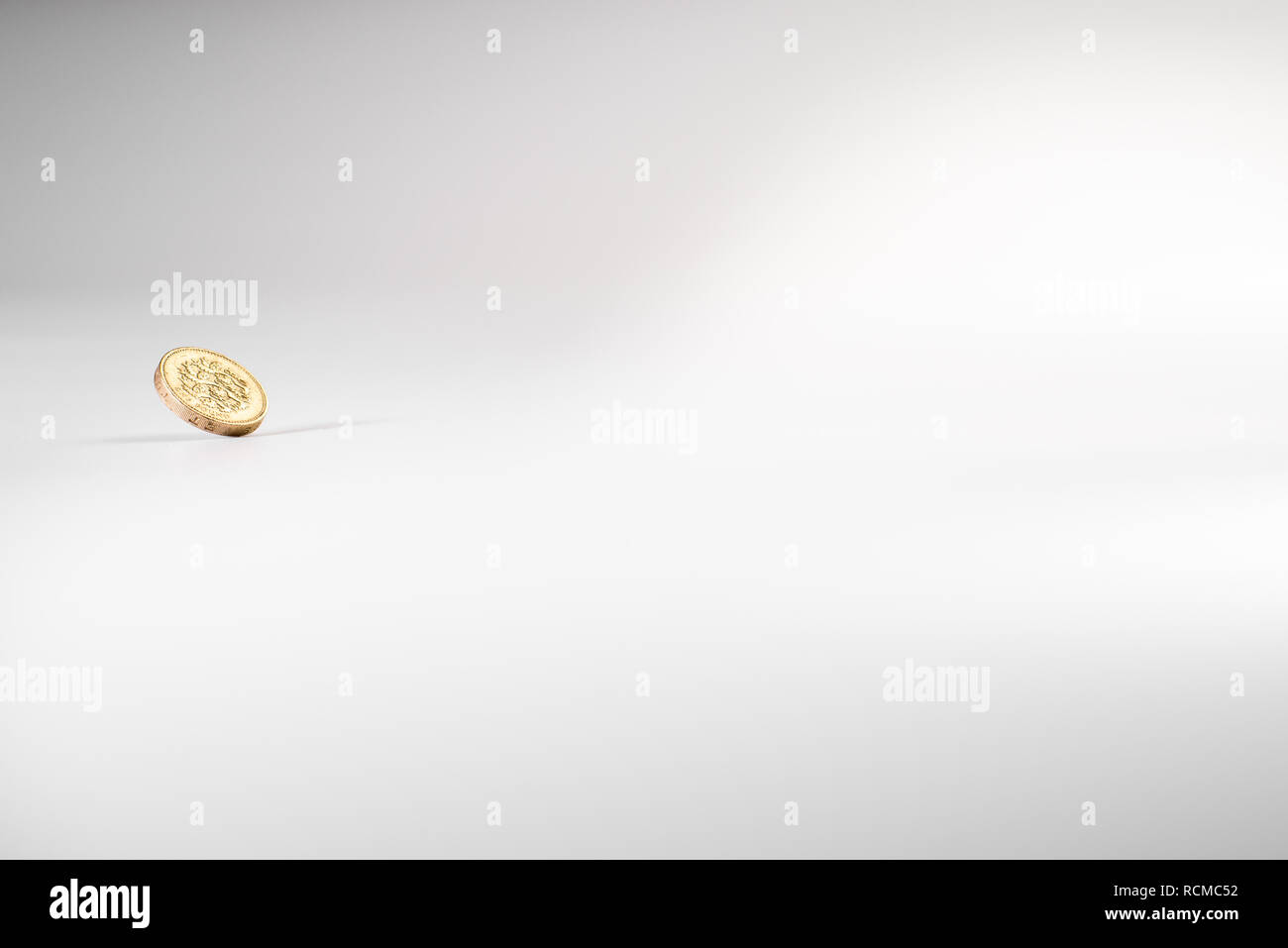 1 British pound coin falling on white background, isolated Stock Photo ...