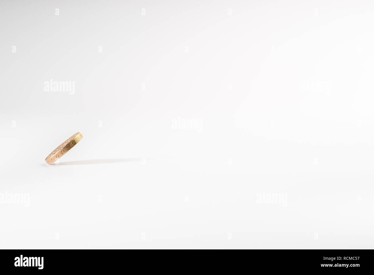 1 British pound coin falling on white background, isolated Stock Photo ...