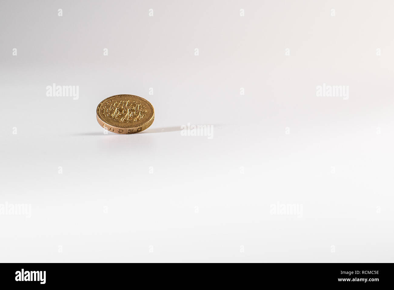 1 British pound coin falling on white background, isolated Stock Photo ...
