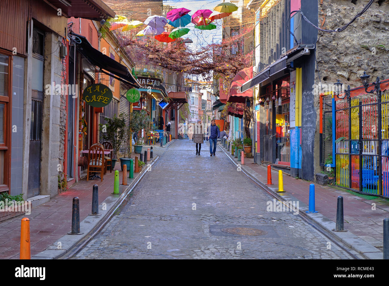 Pedestrian walking down a street in colorful Balat area of Istanbul on ...