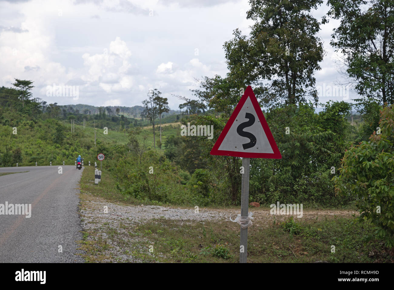curvy road sign in the Nakai highlandsalong the Konglor Loop with ...