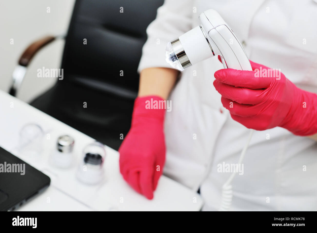 doctor dermatologist diagnoses hair structure using a special tool-a ...