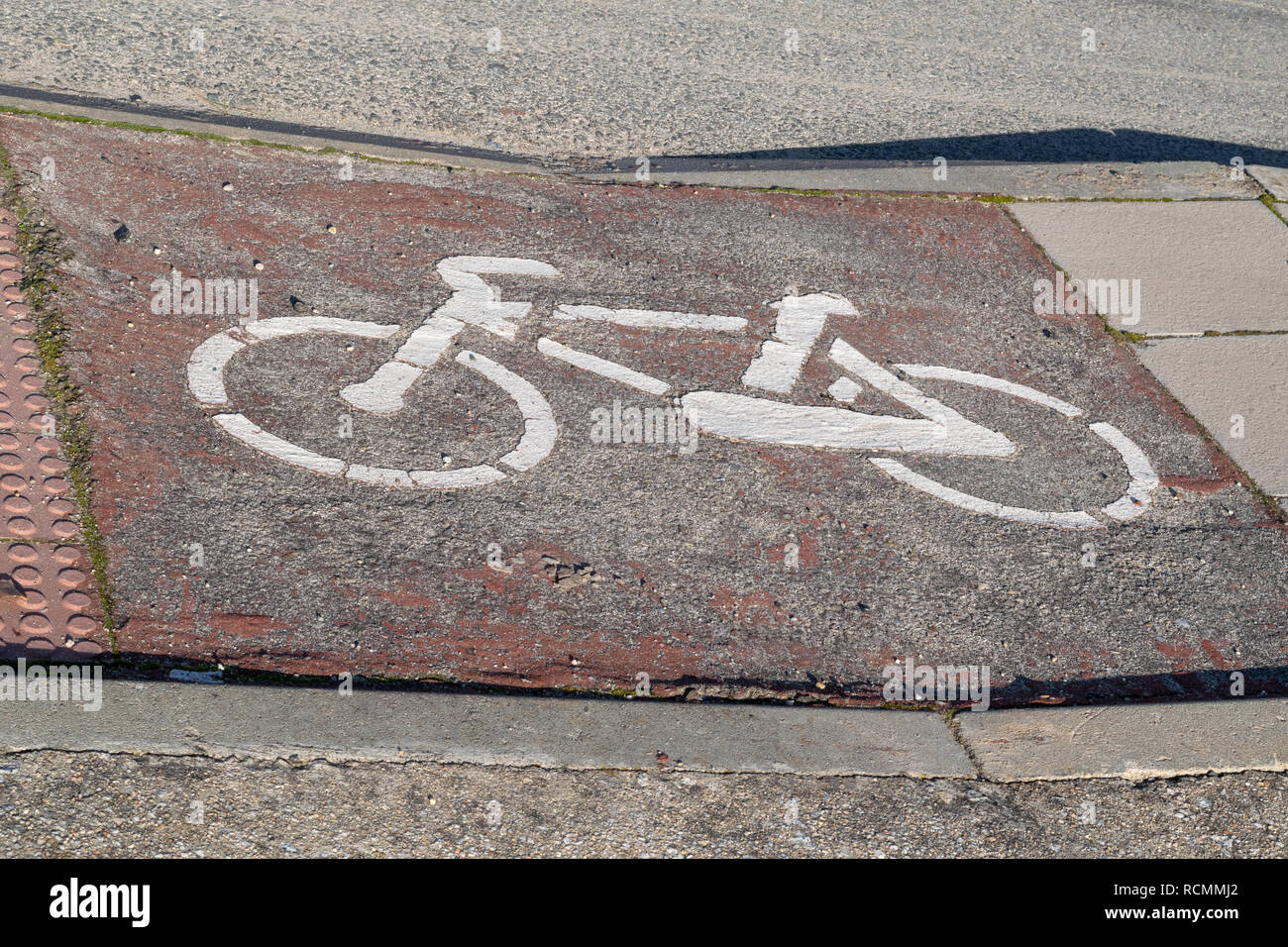 Bicycle lane. Detail. White bicycle symbol on the ground Stock Photo ...