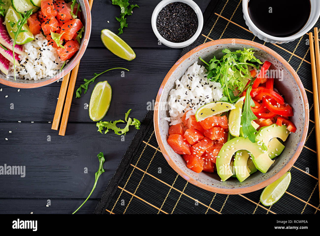 Hawaiian salmon fish poke bowl with rice, avocado, paprika, cucumber ...