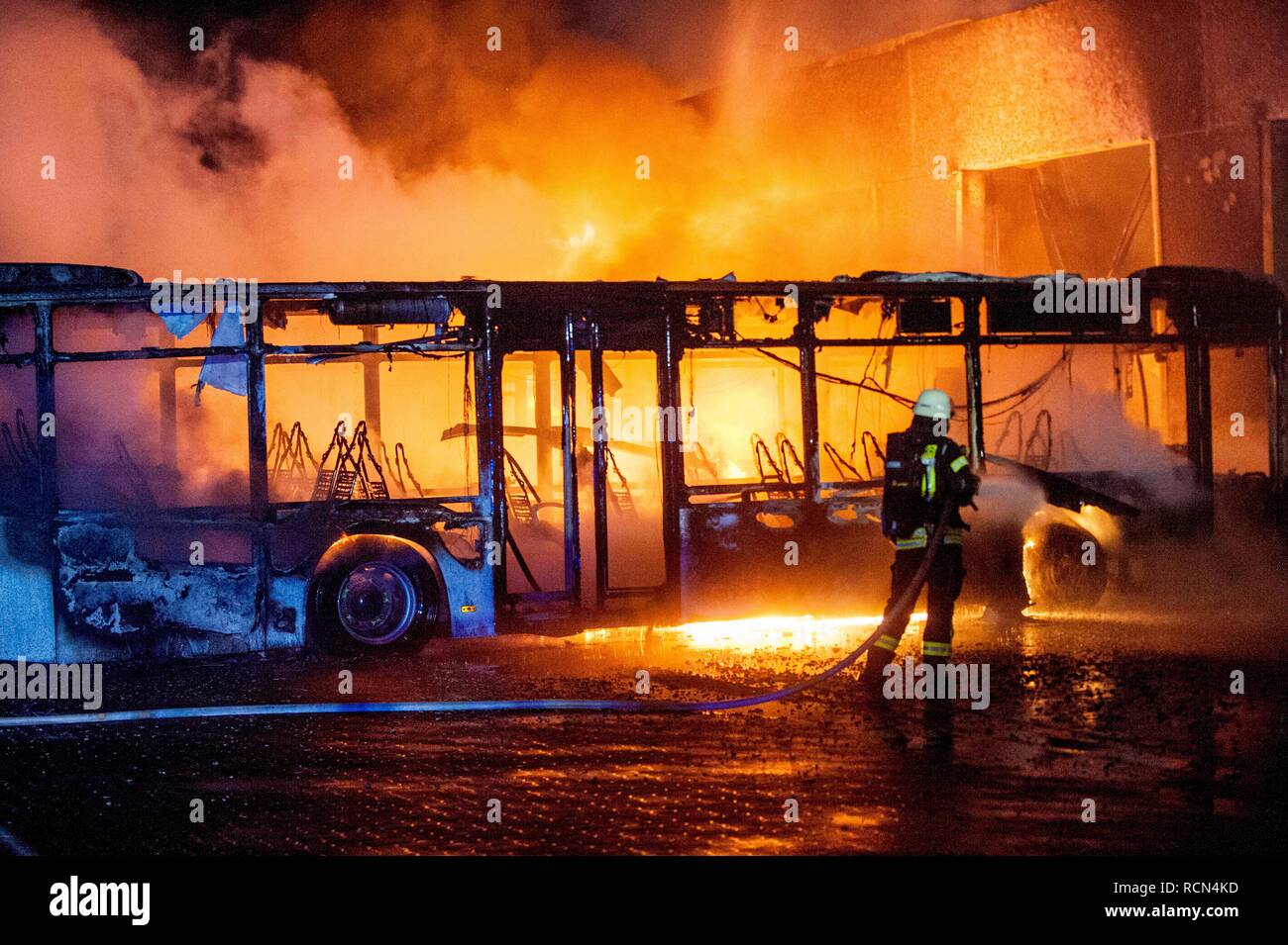 Bielefeld, Germany. 16th Jan, 2019. A firefighter extinguishes a ...