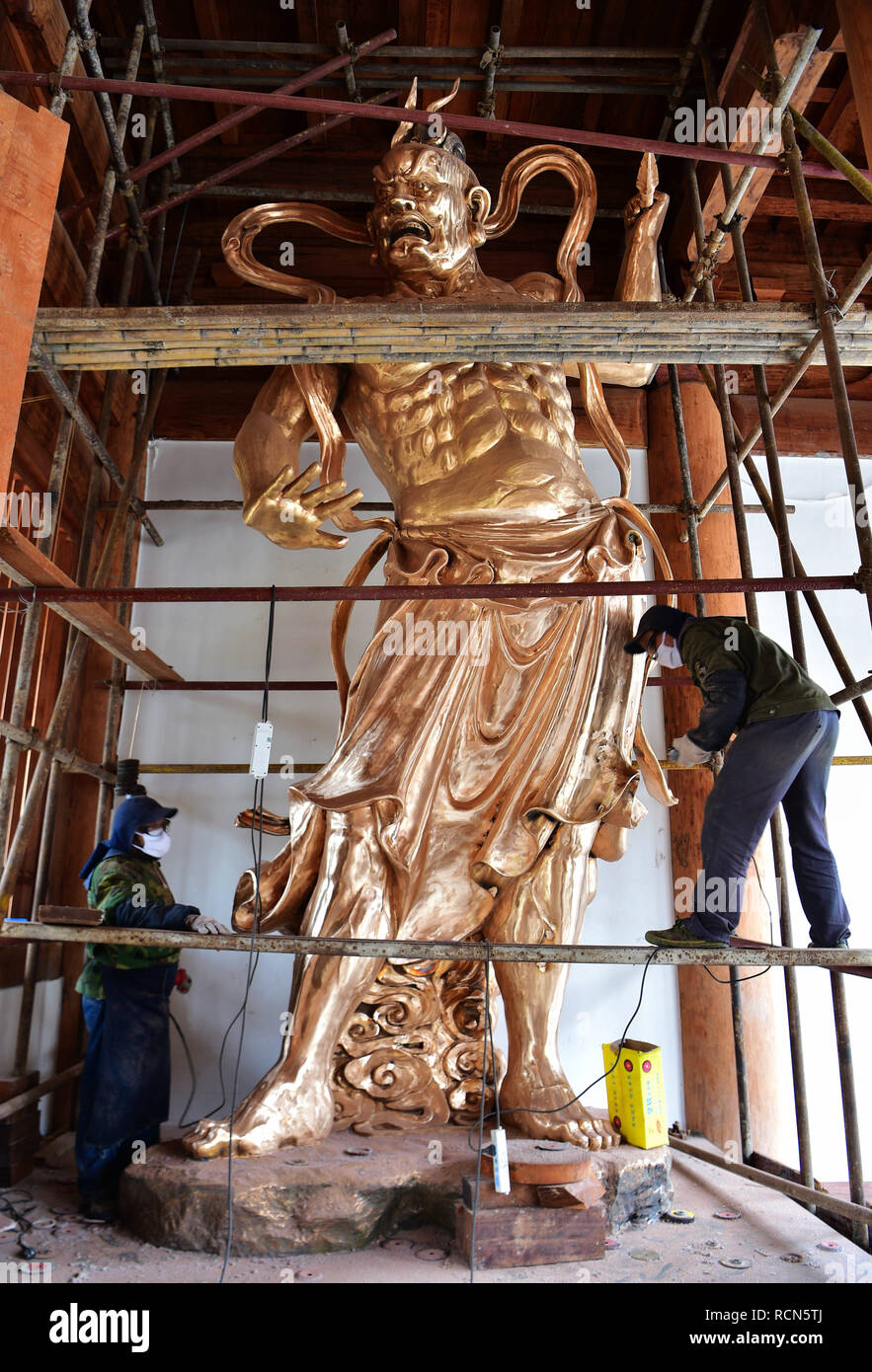 Fuqing, China's Fujian Province. 15th Jan, 2019. Workers polish statues ...