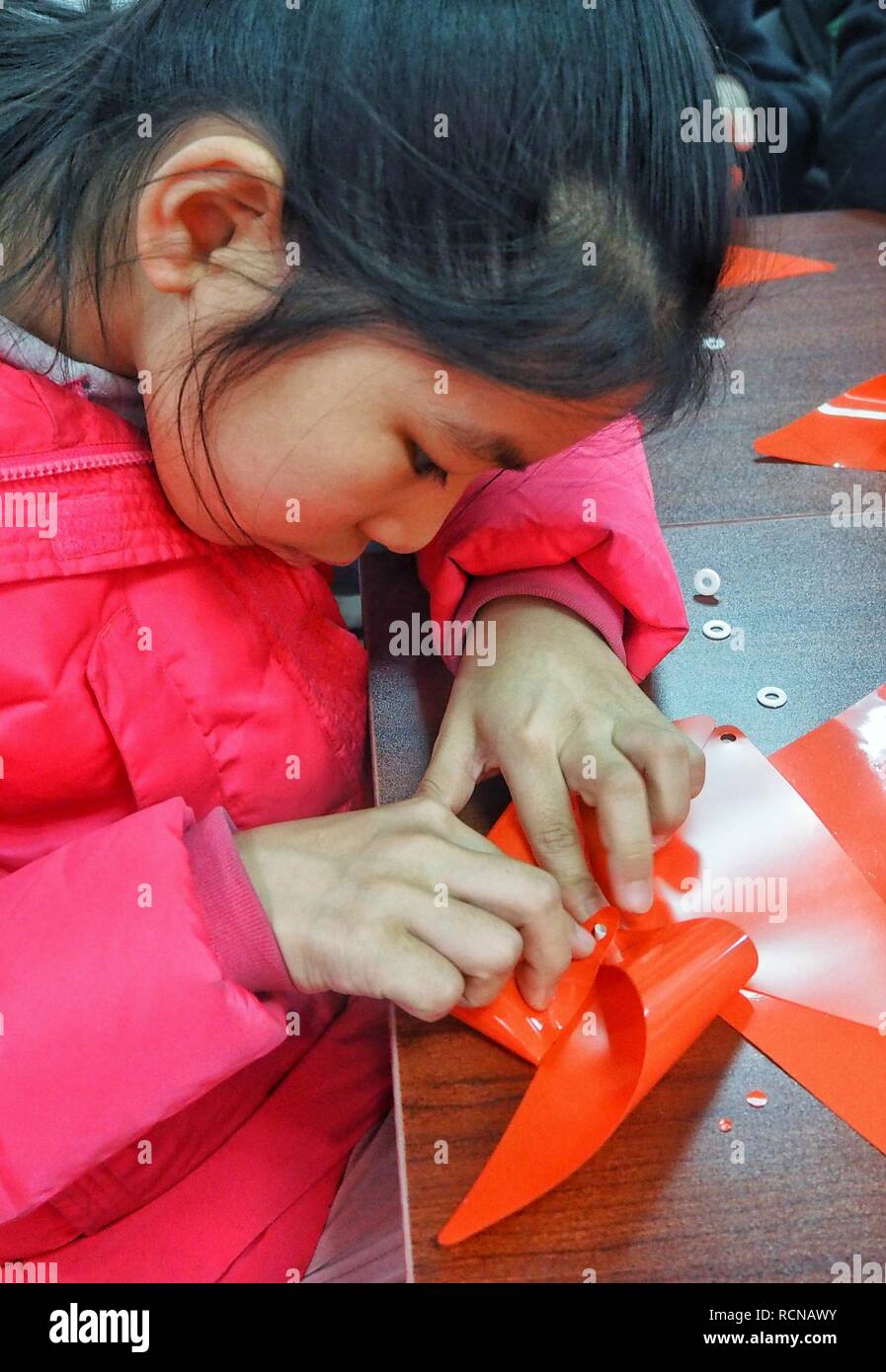 Girl with a pinwheel hi-res stock photography and images - Alamy