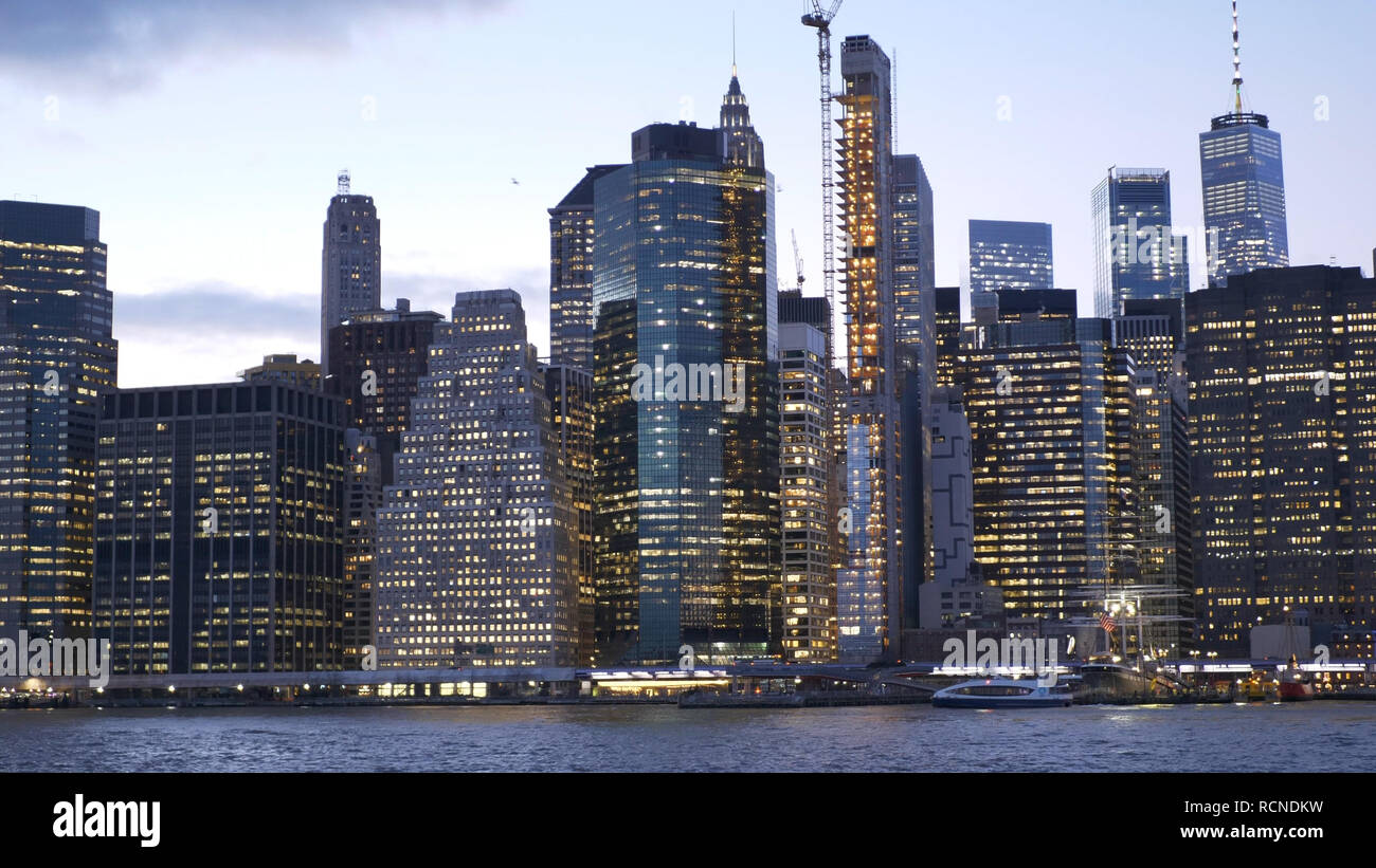 Beautiful Manhattan skyline and New York city lights in the evening ...