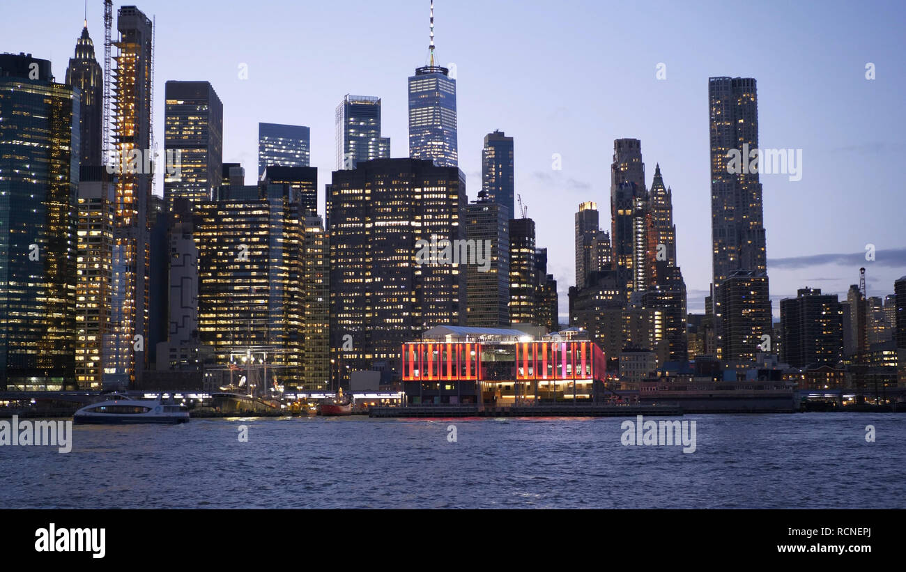 Beautiful Manhattan skyline and New York city lights in the evening ...