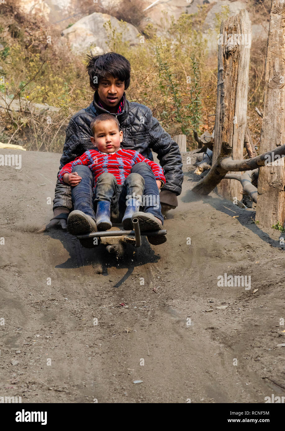 Children sledding down a slope at Rashol Stock Photo - Alamy