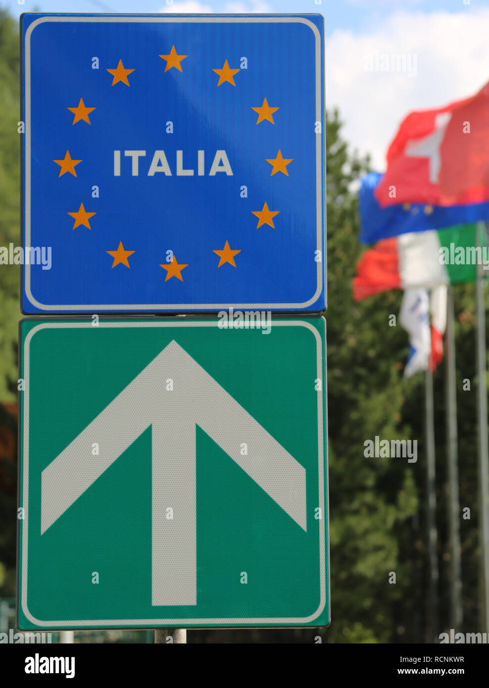 blue road sign indicating the Italian state border Stock Photo - Alamy
