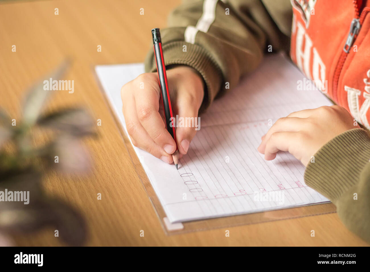 Child hand writing letters learning hi-res stock photography and images ...