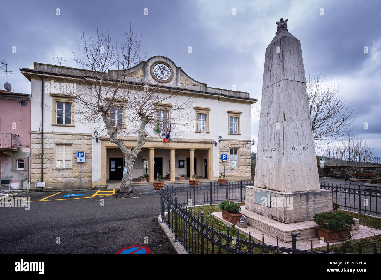 The town hall with the obelisk dedicated to the fallen civilians of the ...