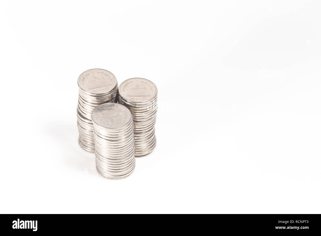 Pile of silver coins on white background Stock Photo - Alamy