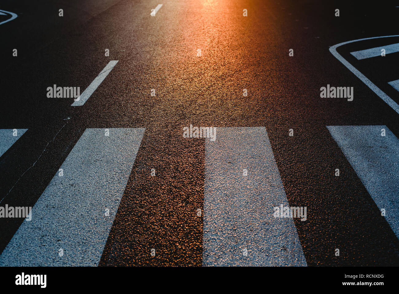Lonely street with pedestrian crossing at sunset, texture with space ...