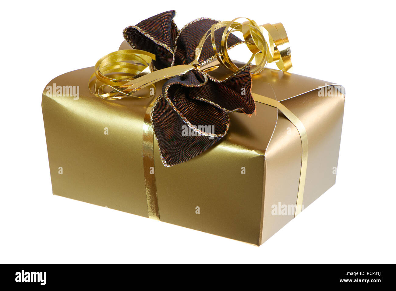 Closeup of an isolated present in a golden package Stock Photo - Alamy