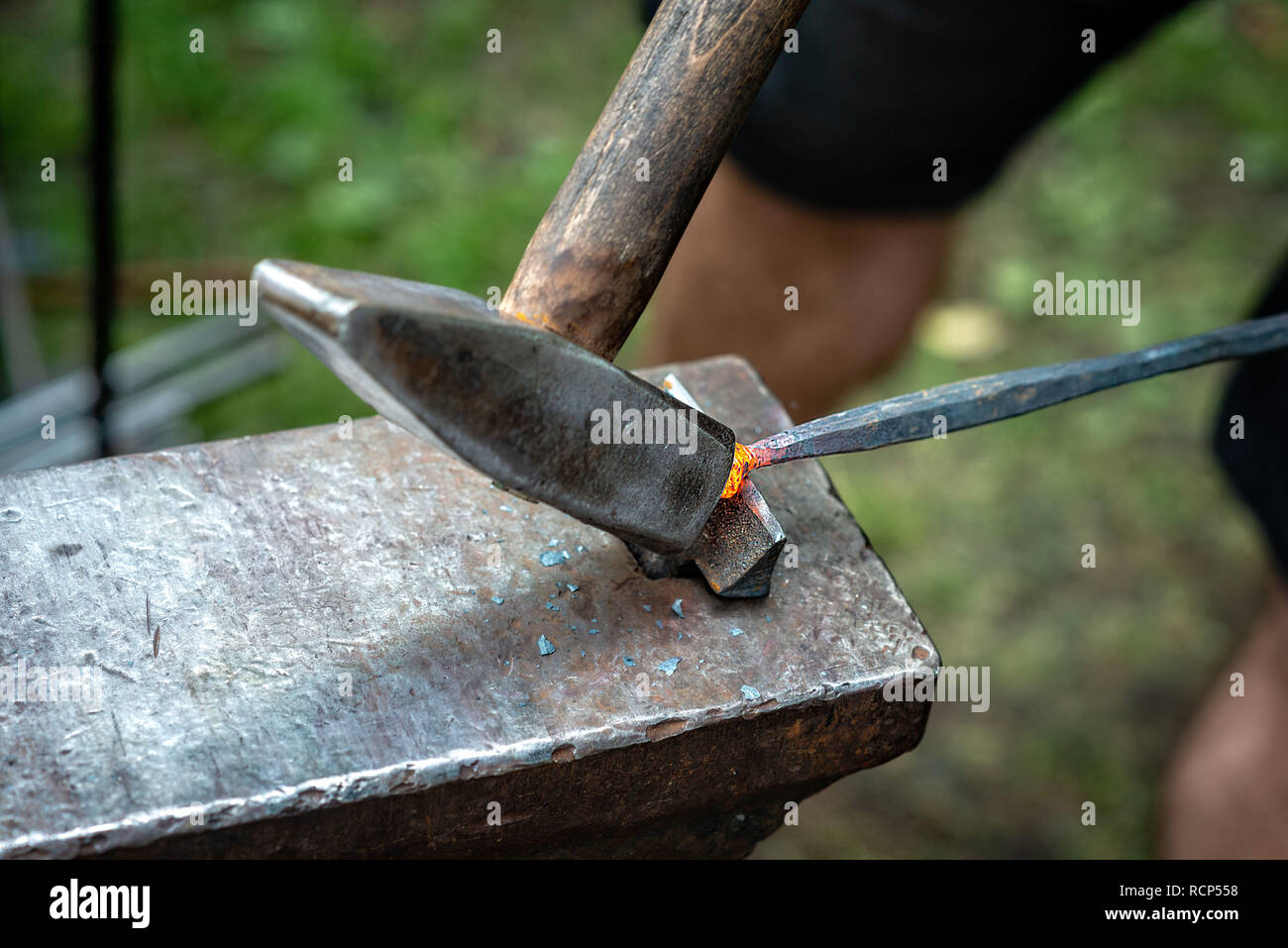 Forge, blacksmiths work with hummer, hot metal - Image Stock Photo - Alamy