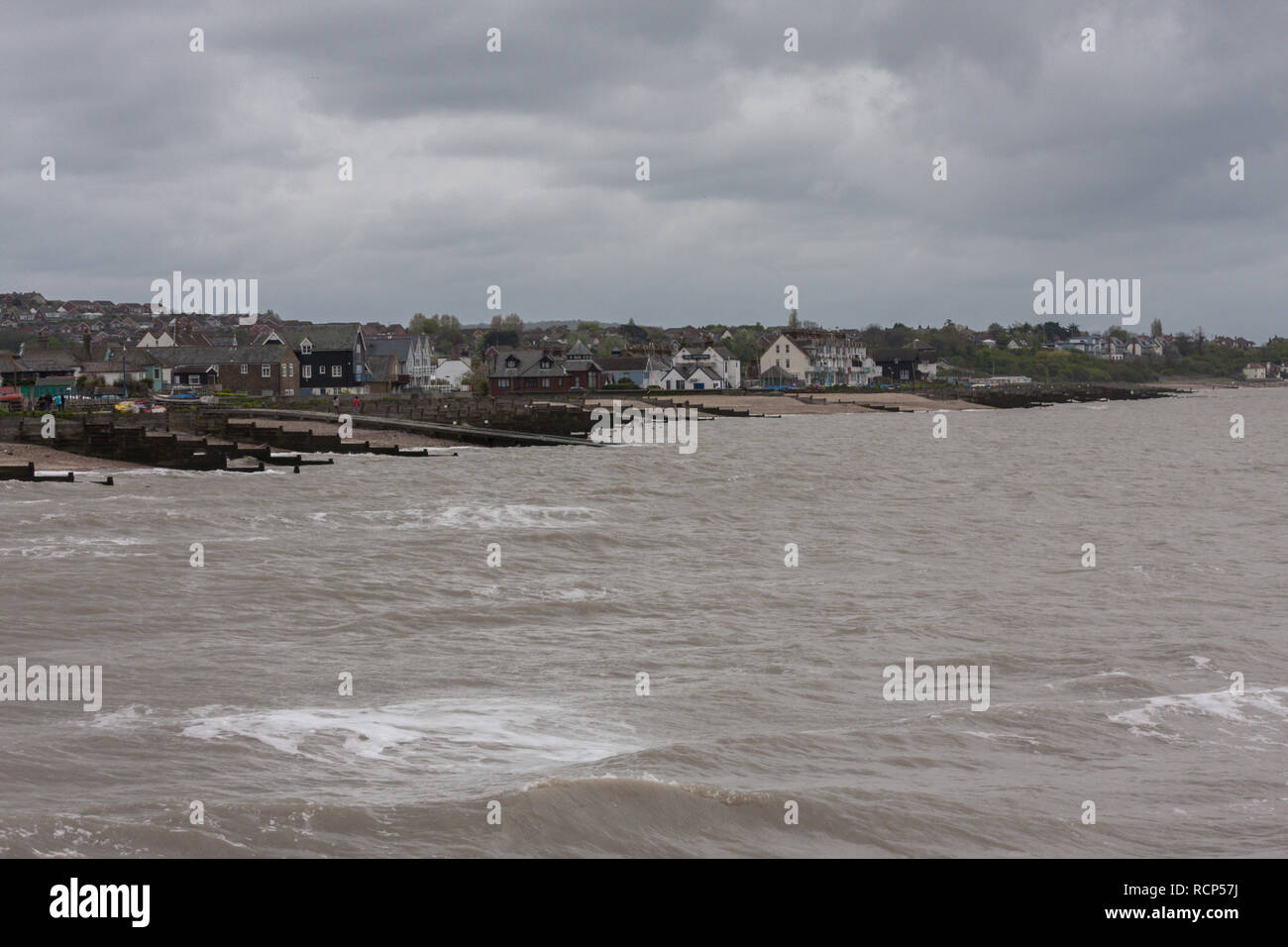 Whitstable seafront on a windy, cold overcast spring day. Kent, England ...