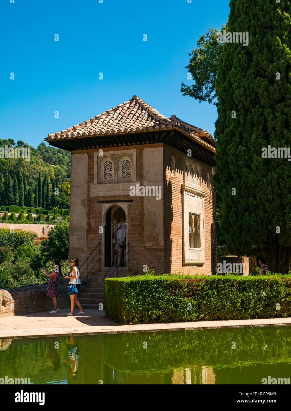 Tourists at Partal Palace with reflection in water pool, Alhambra ...