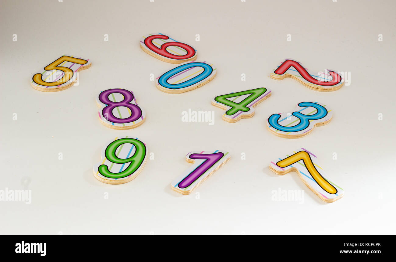 Toy wooden numbers in different colours Stock Photo - Alamy