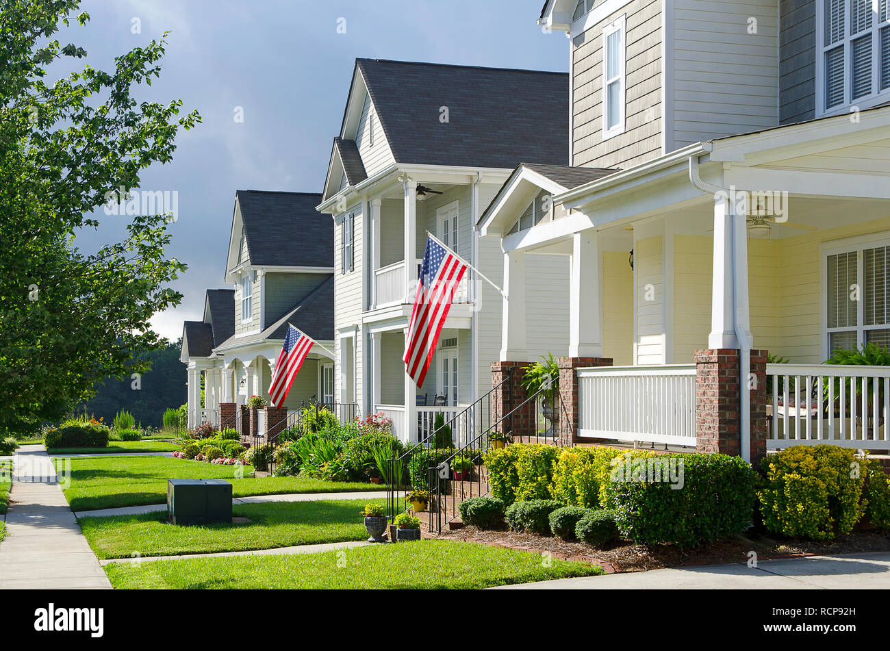 Row of Homes Flying the American Flag Stock Photo - Alamy