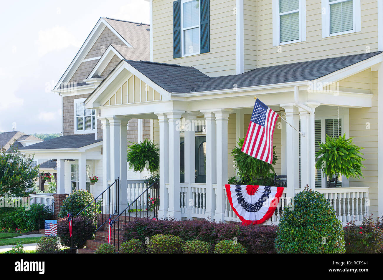 Row of Homes Flying the American Flag Stock Photo - Alamy