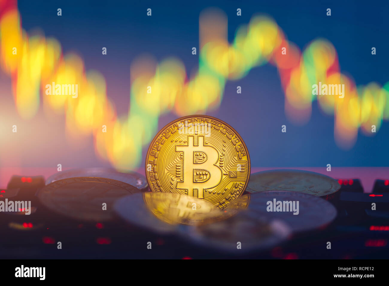 Bitcoin gold coin and defocused chart background. Virtual ...
