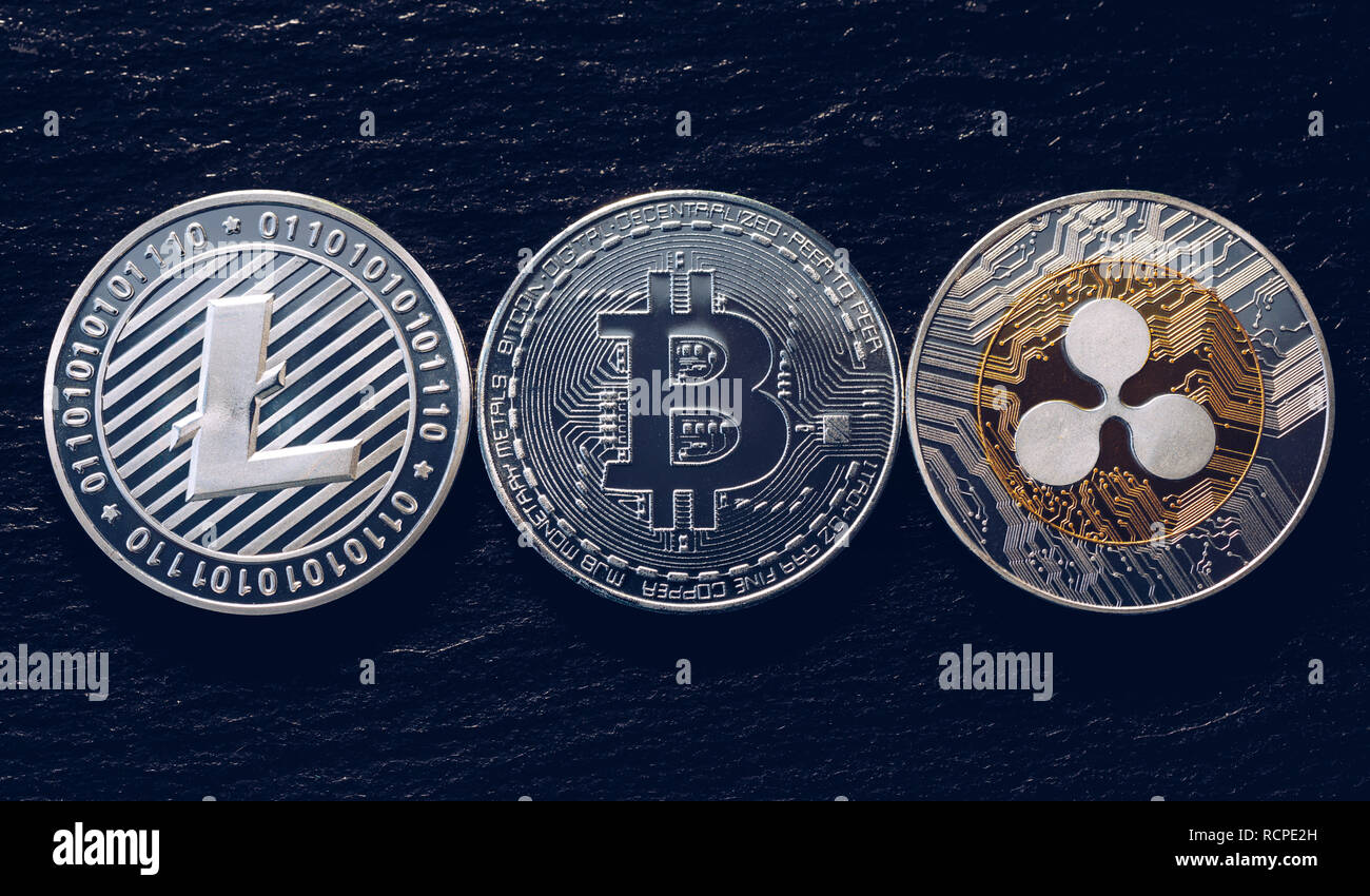 Bitcoin, litecoin and ripple coins currency finance money on graph ...