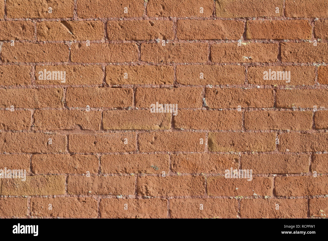 Antique weathered brick wall background abstract with deteriorating red ...