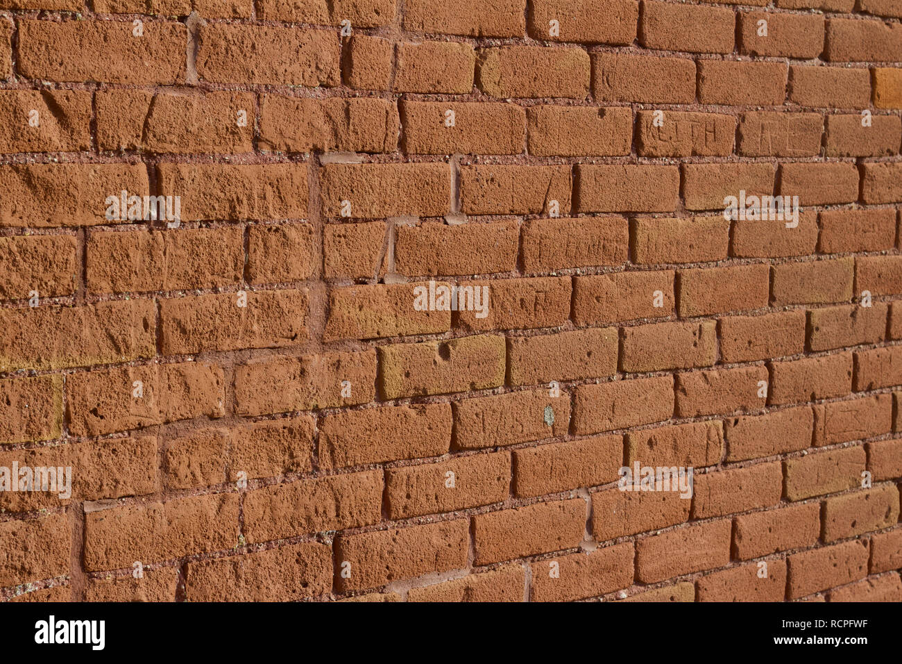 Antique weathered brick wall background abstract with deteriorating red ...