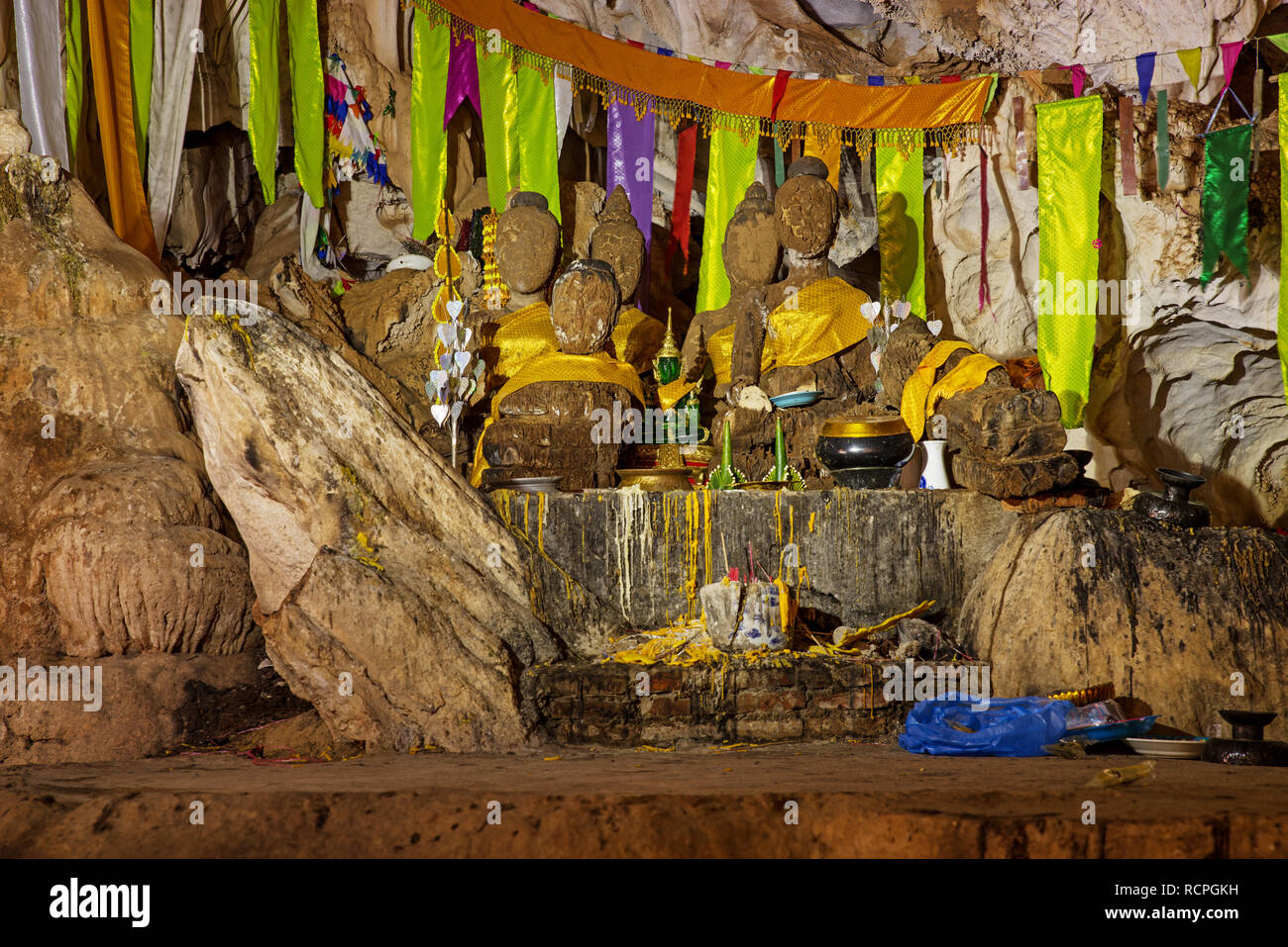 Buddhist shrine in Tham Pha In cave near Thakhek Laos Stock Photo - Alamy