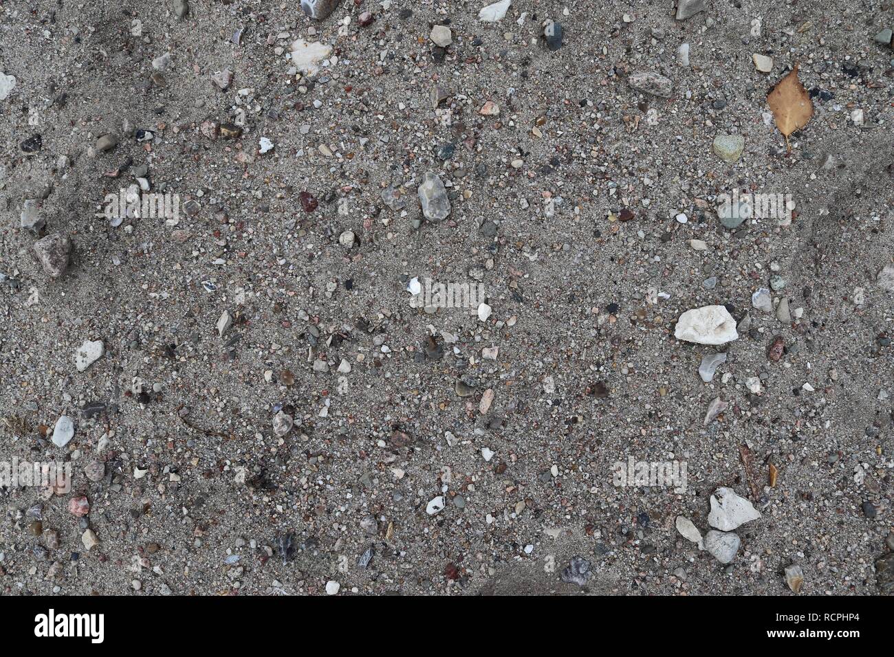 Close up high resolution surface of sand with footprints on the ground ...
