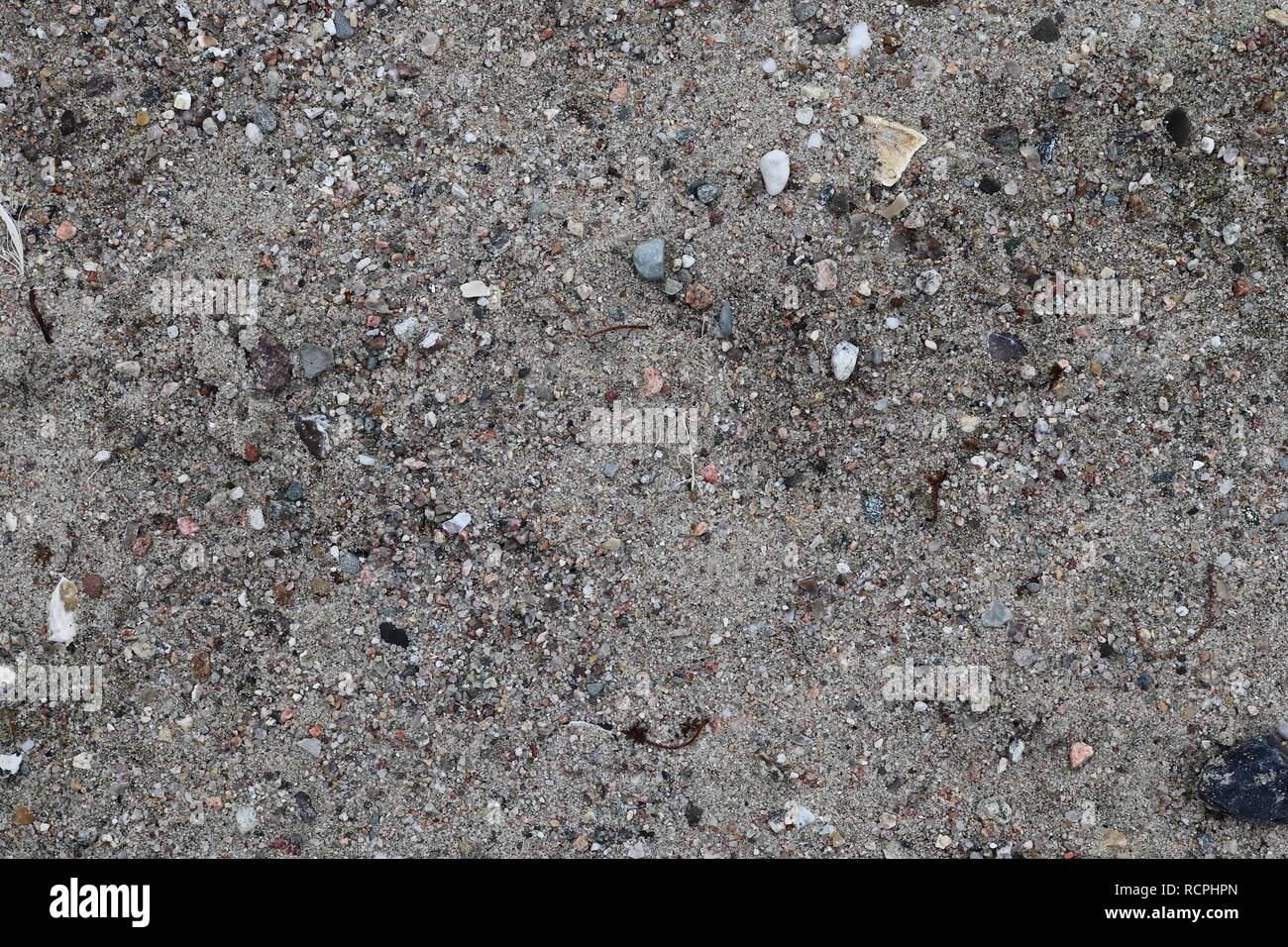 Close up high resolution surface of sand with footprints on the ground ...