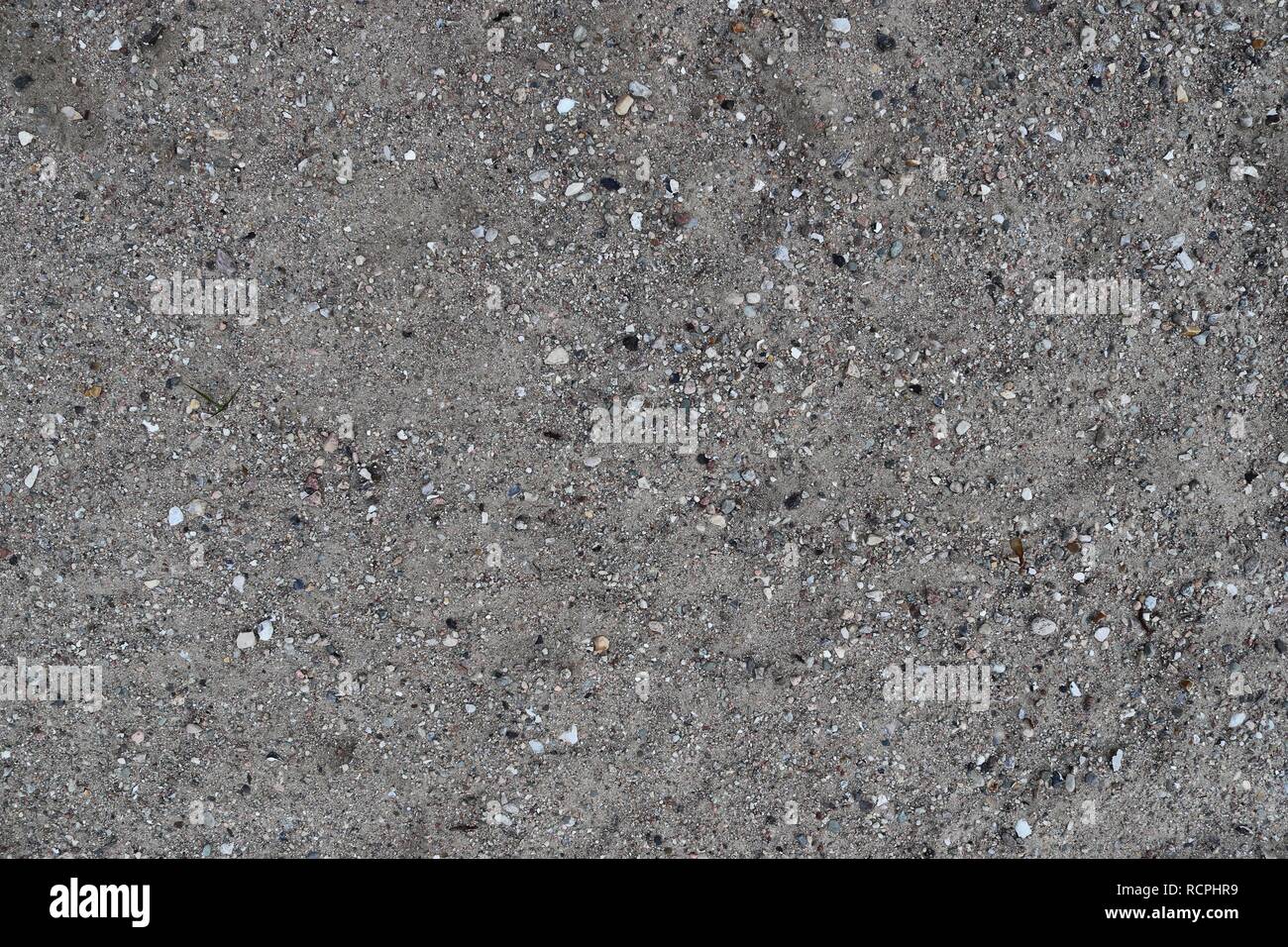 Close up high resolution surface of sand with footprints on the ground ...